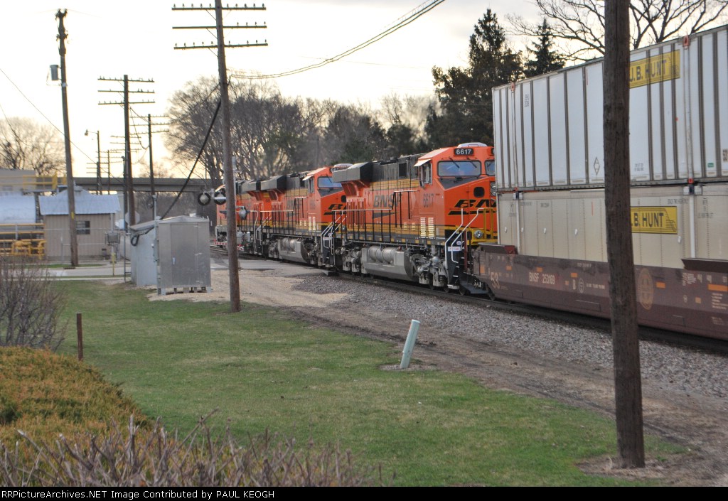 BNSF 6617 3rd unit behind lead BNSF 6610 and BNSF 6609 roll east past me.